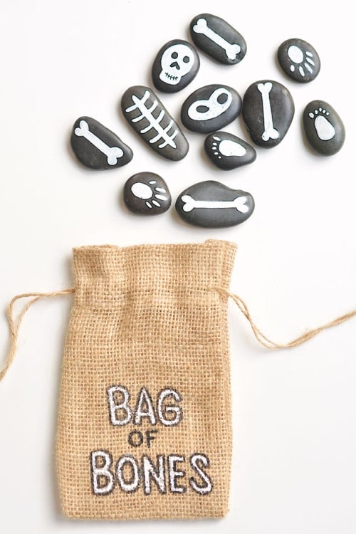 Bag of Bones Halloween Painted Rocks | Skeleton Rock Painting